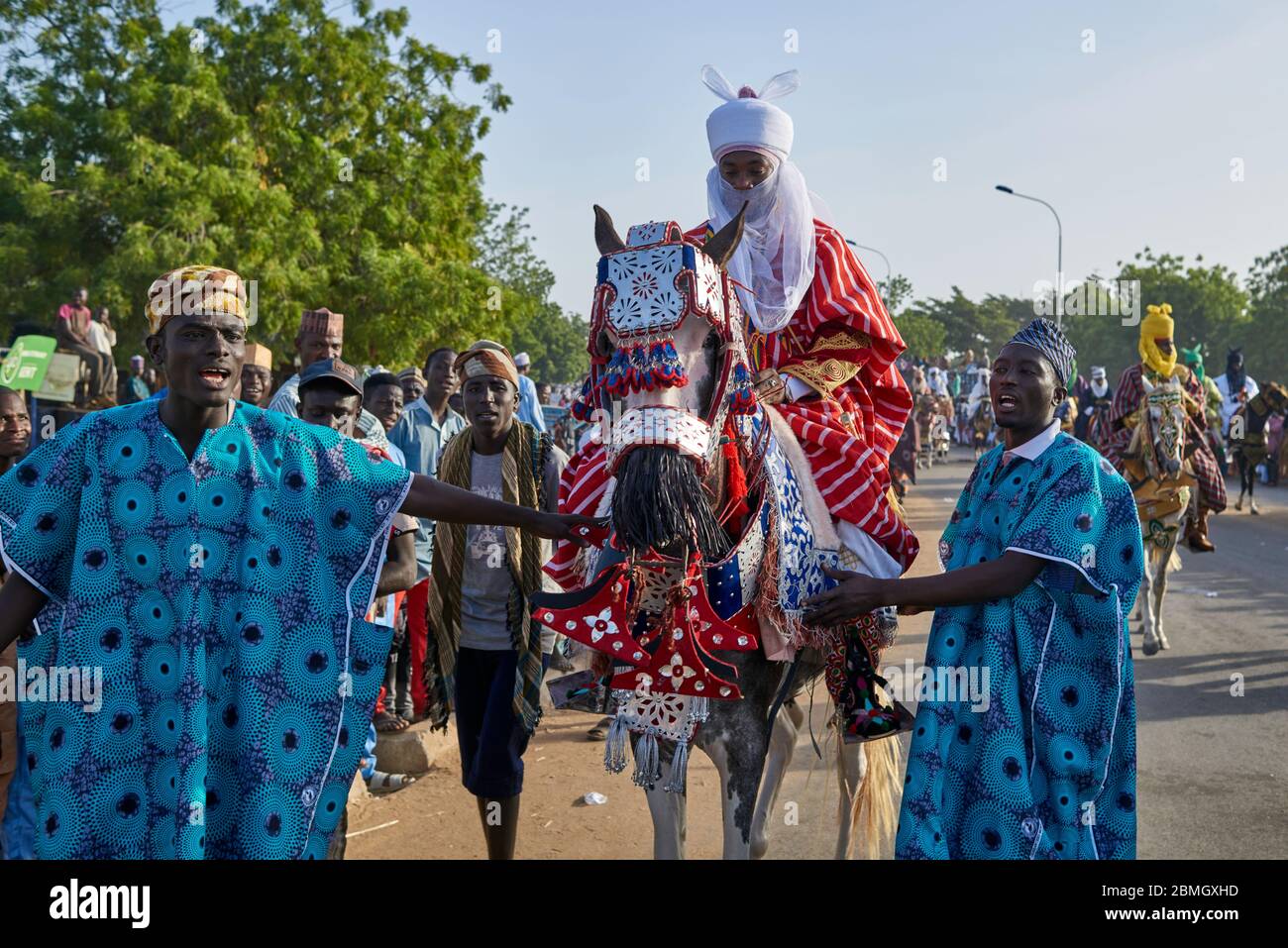 Nobleman rider dressed in a colourful outfit mounting an embellished ...