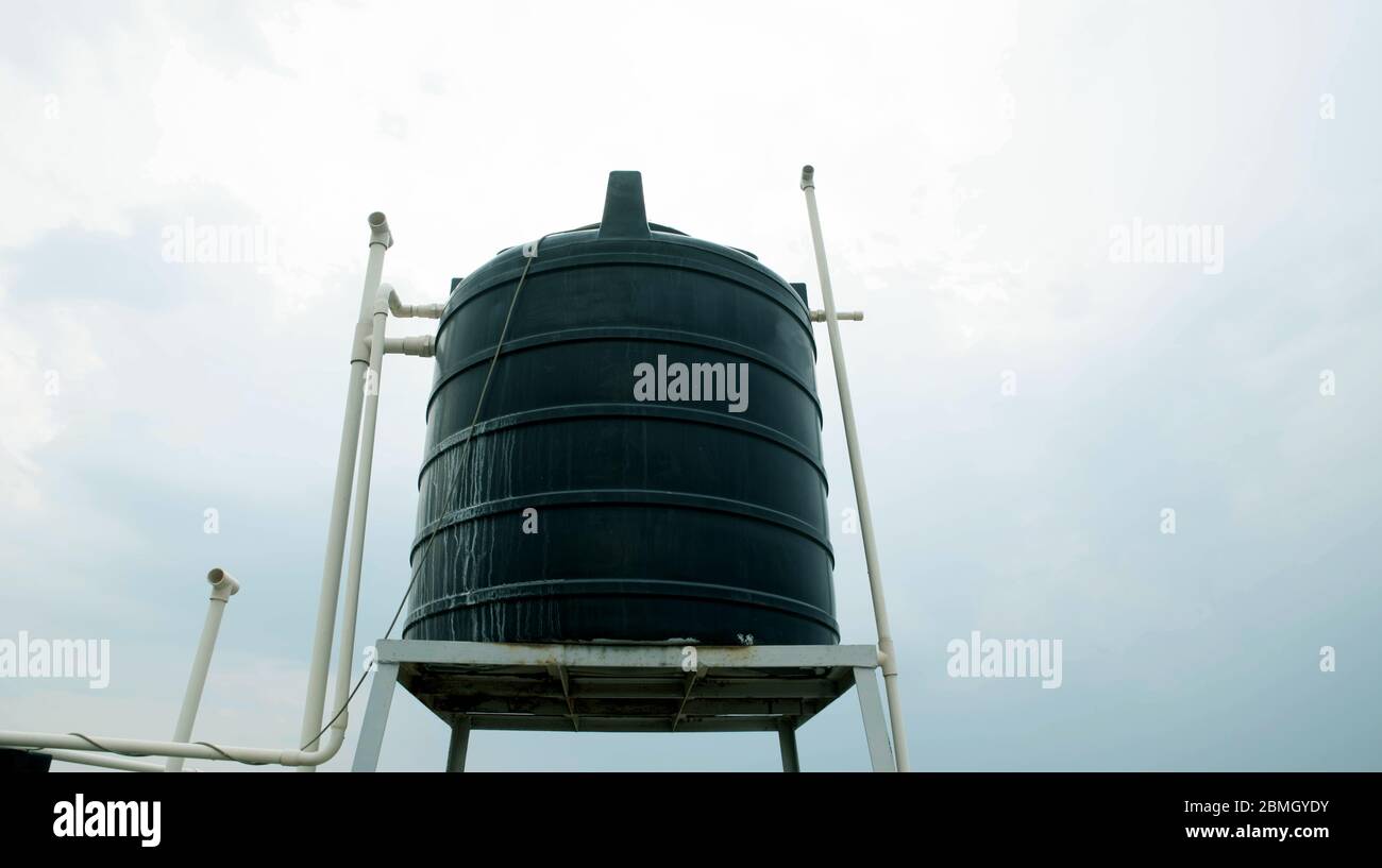 over head tank on sky background Stock Photo - Alamy