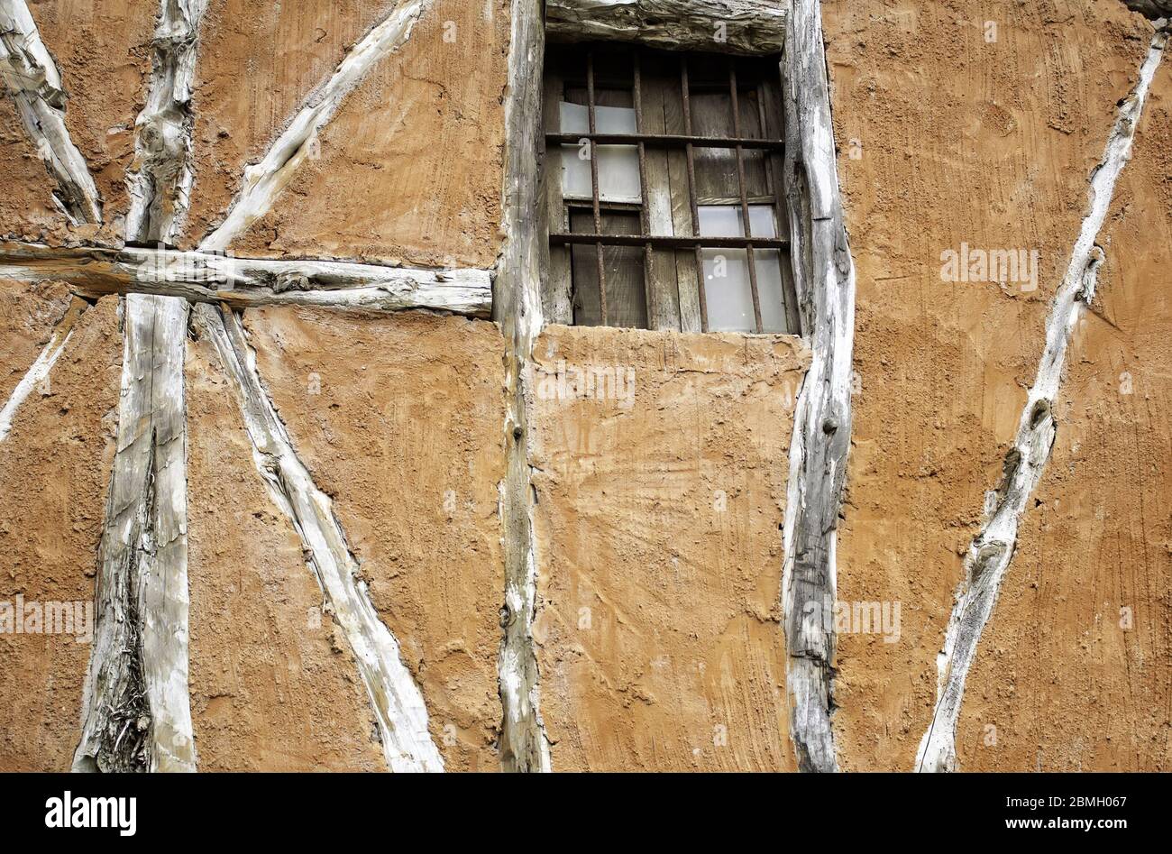 Rustic window with bars in town house, construction and architecture ...