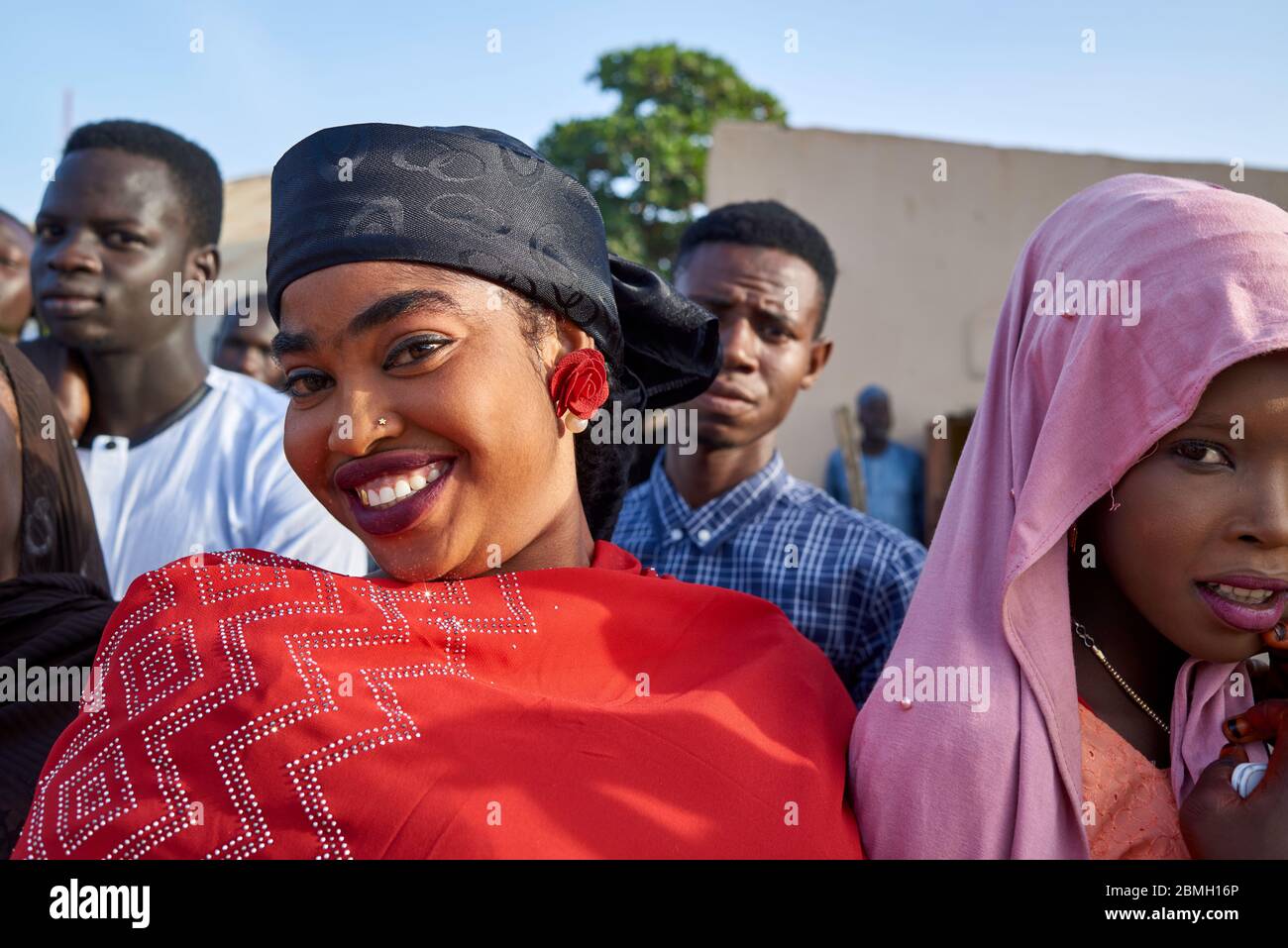 Crowd cheering the Emir of Gumel as he passed through the streets of ...