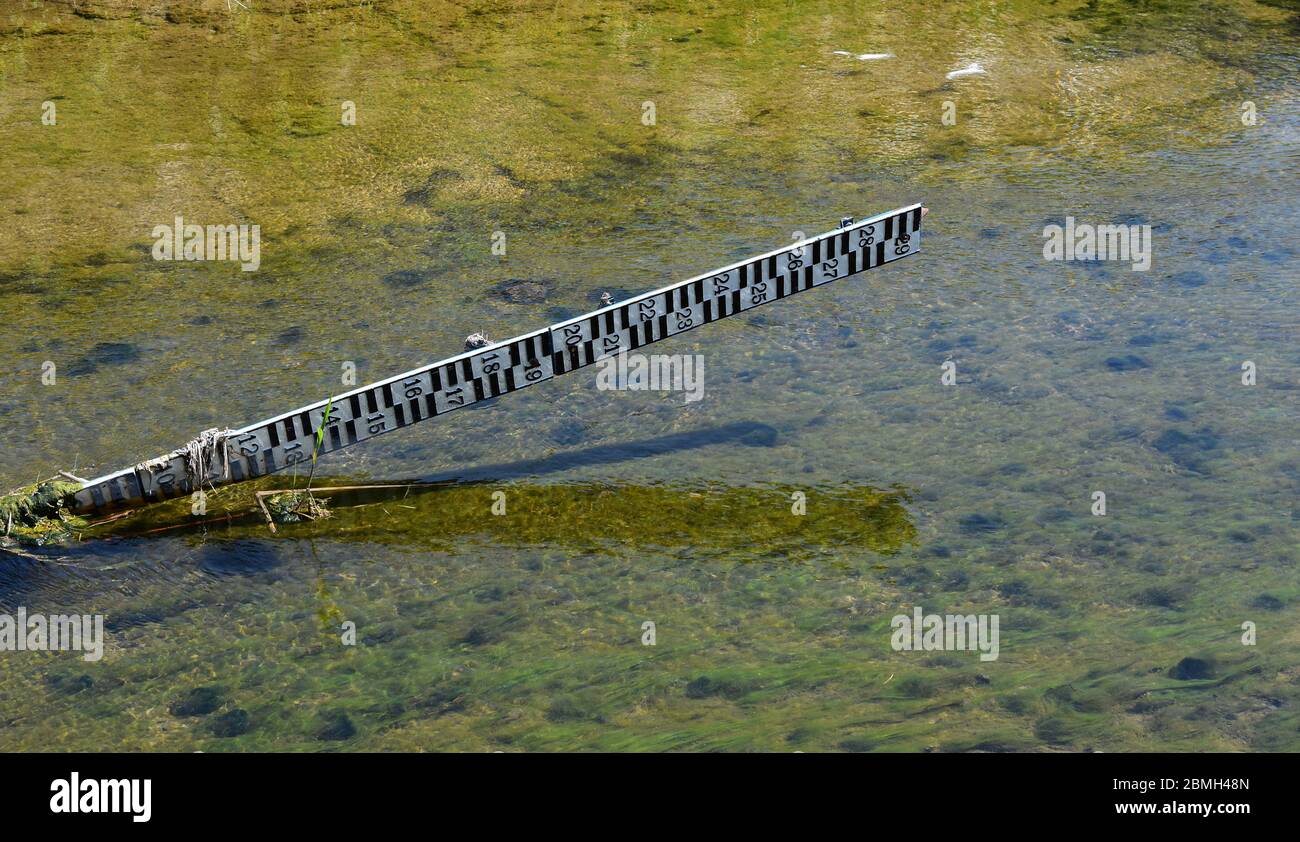 Water meter bar on shallow river Stock Photo - Alamy