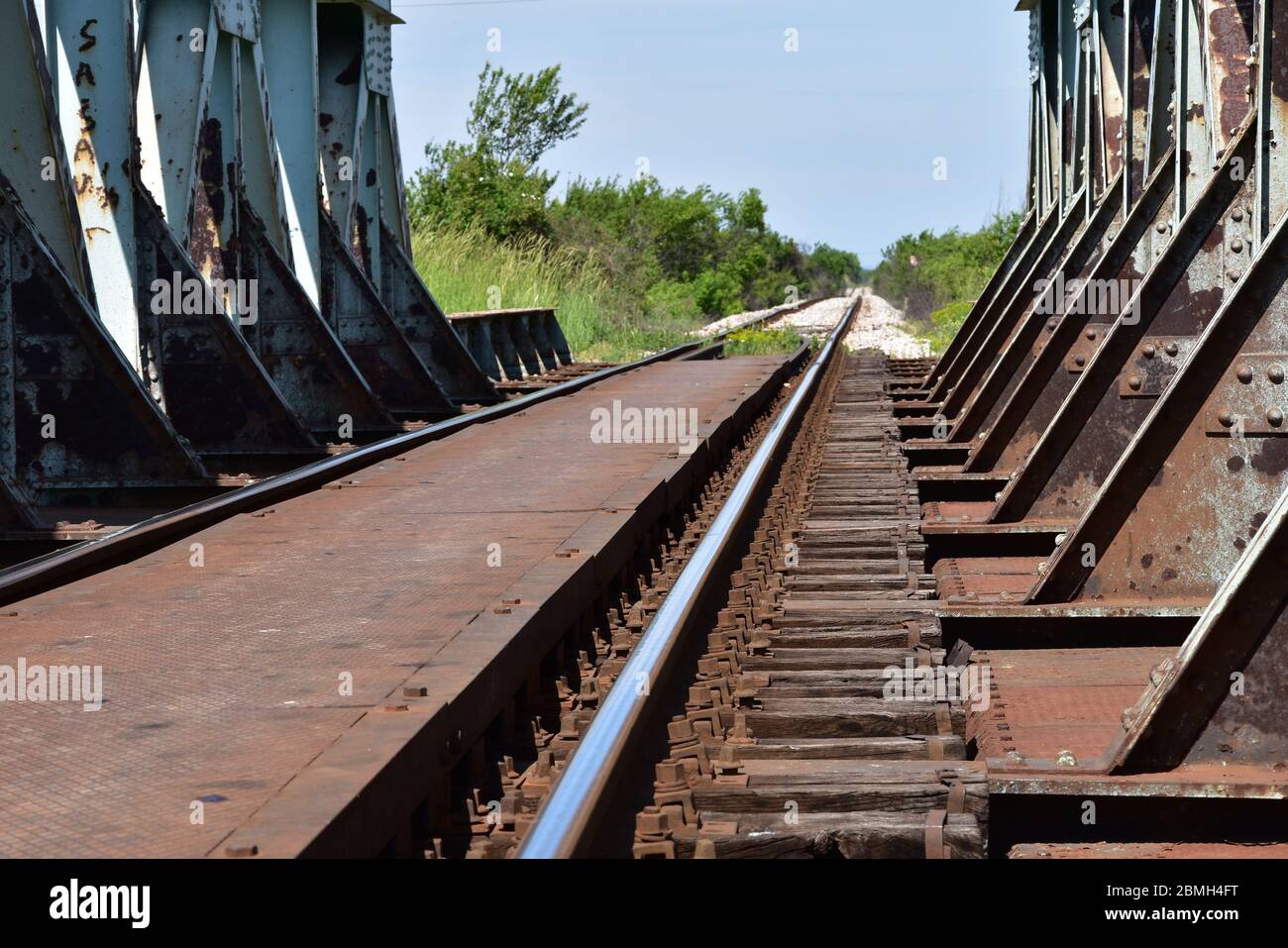 Old rusty metal rail bridge Stock Photo - Alamy