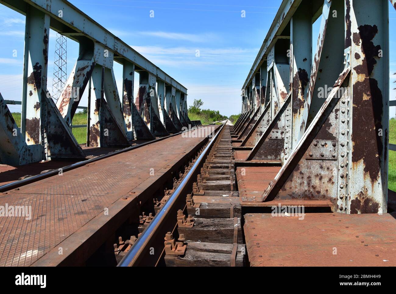 Old rusty metal rail bridge Stock Photo - Alamy