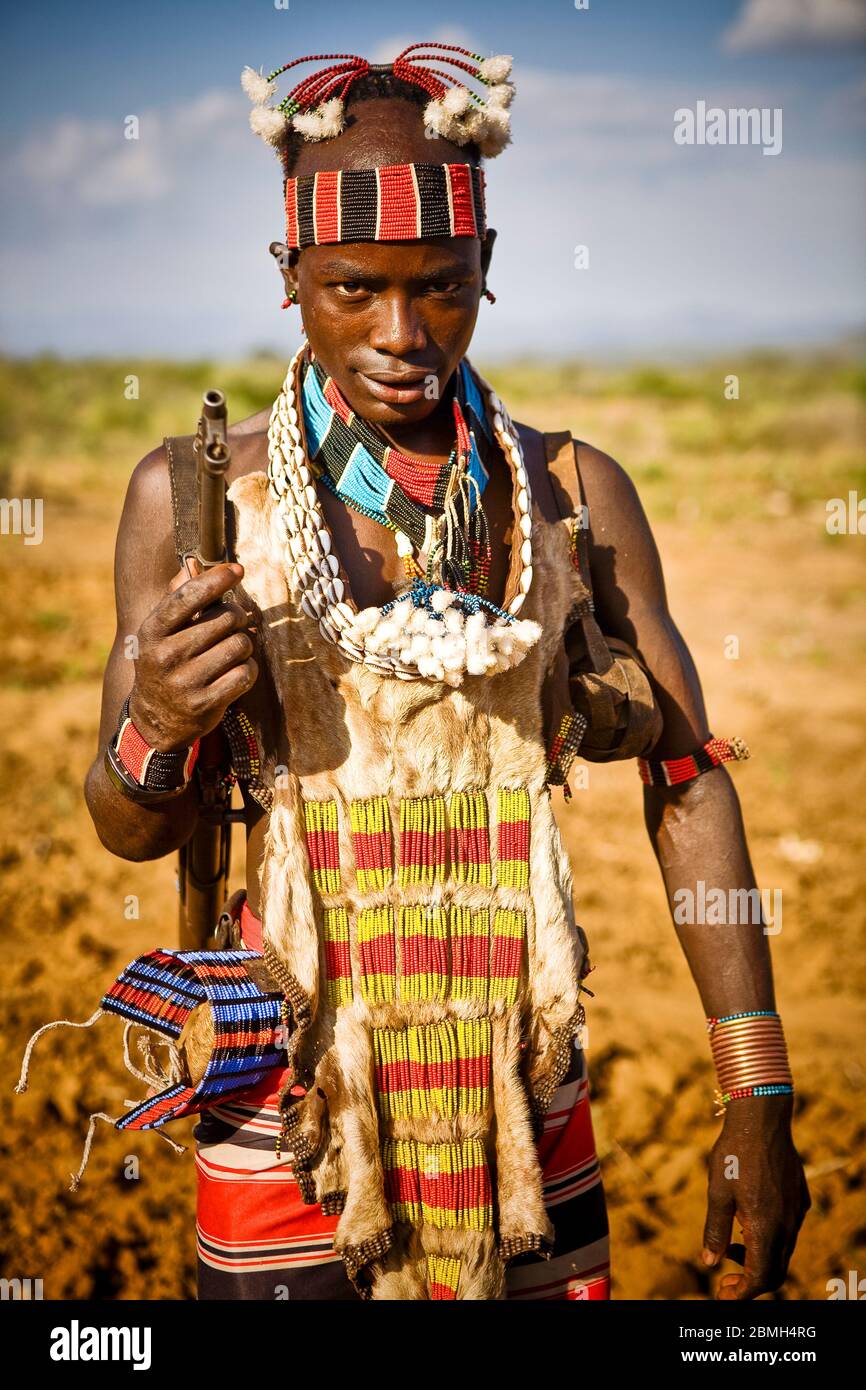 A young Hamer man poses plenty decorated for a photo Stock Photo - Alamy