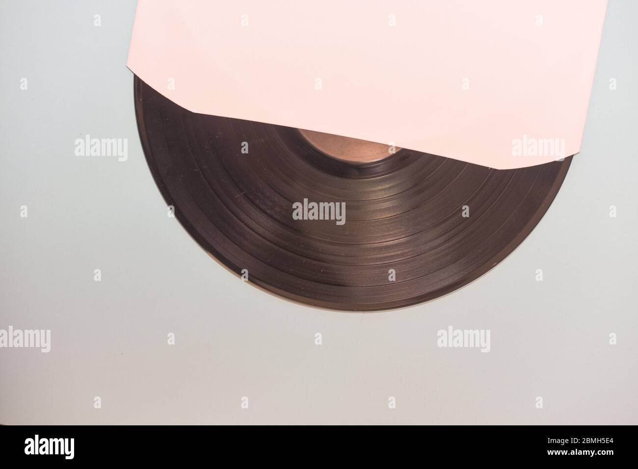 Vinyl record in sleeve against isolated background Stock Photo - Alamy