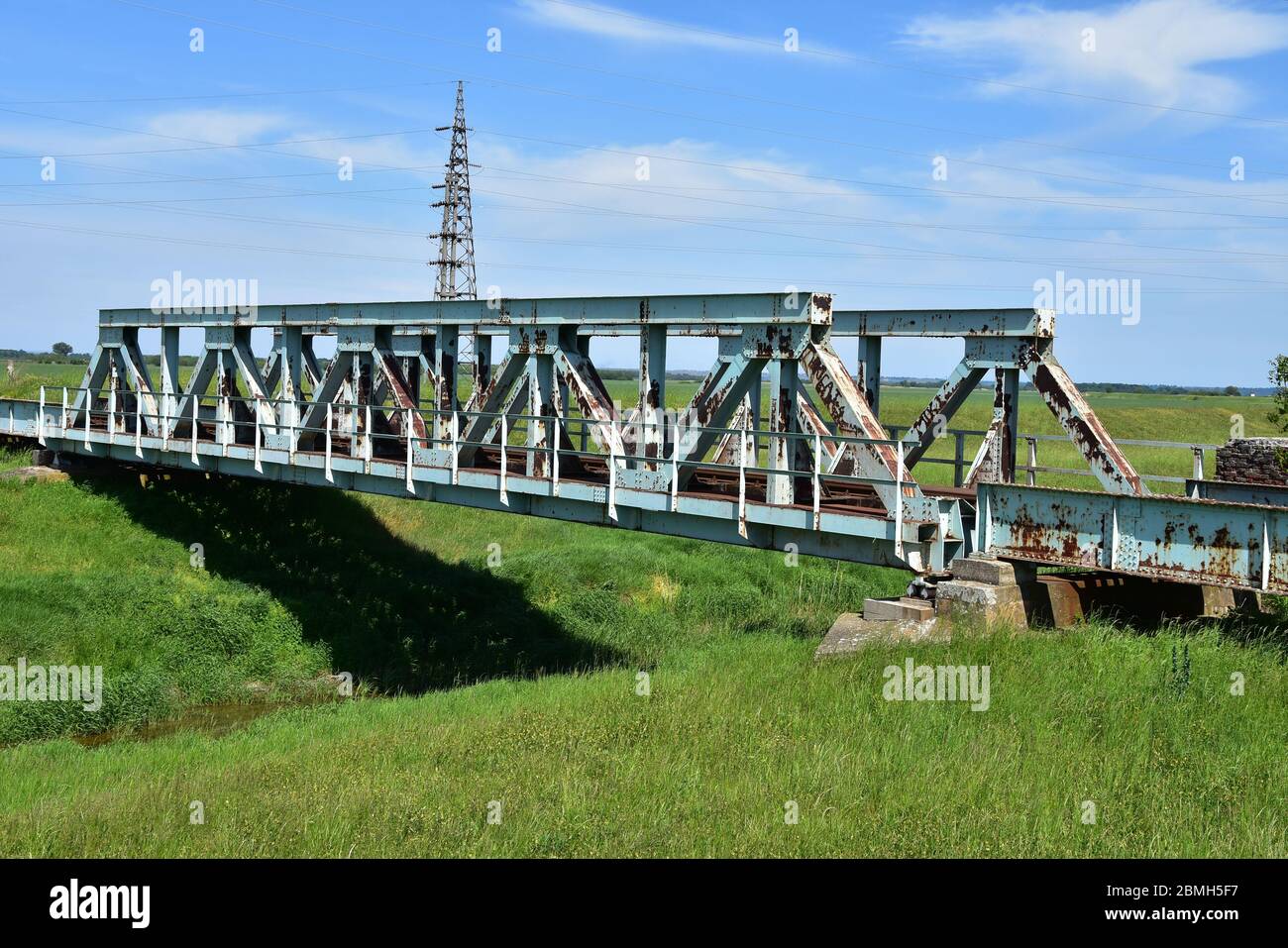Old rusty metal rail bridge Stock Photo - Alamy