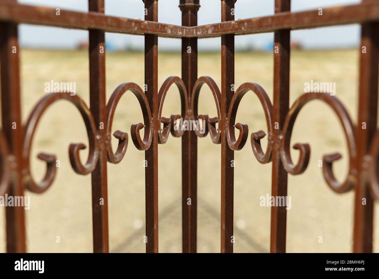 Decorative wrought iron fence. Patterns on the fence Stock Photo - Alamy