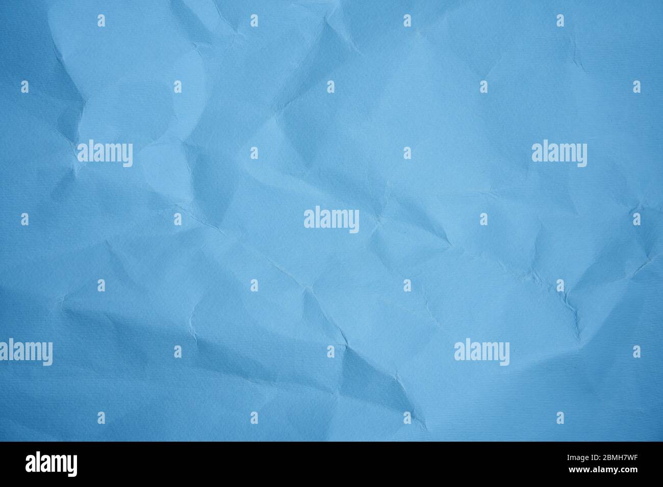 Blue Sheet crumpled paper color background Close up Copy space for text ...