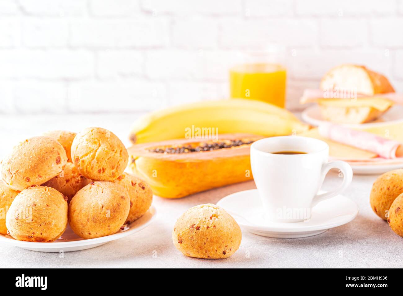 Traditional Brazilian breakfast - cheese bread, coffee, ripe fruit ...