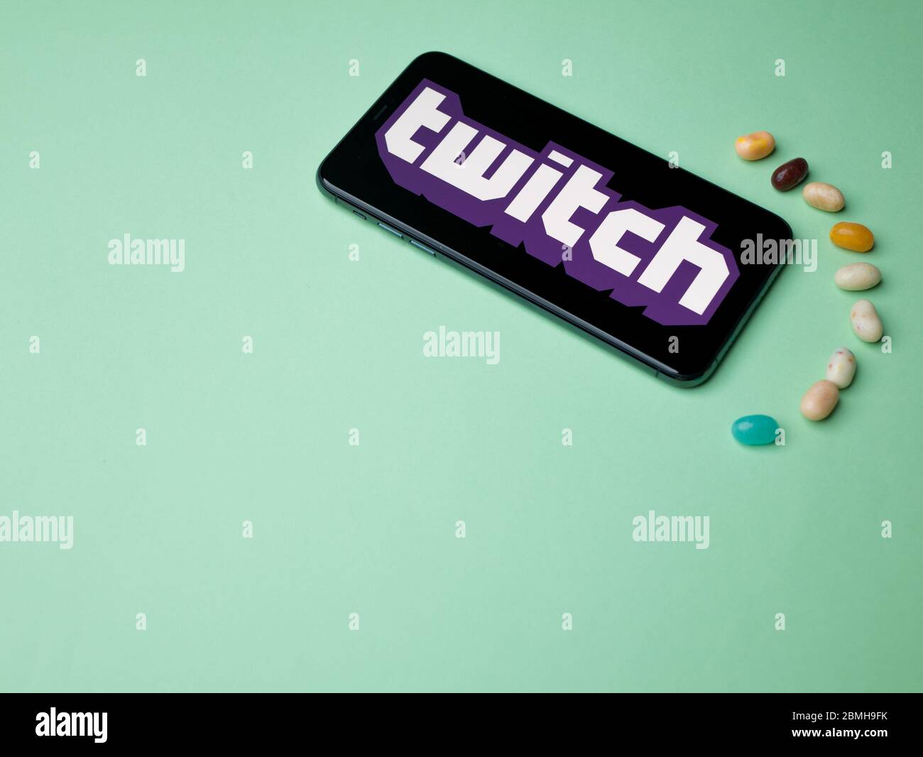 USA - May, 2020 Twitch Iphone Application Screen with candy on colored ...