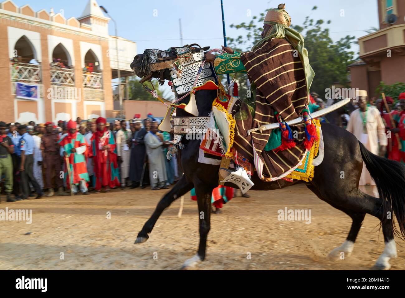 Nobleman rider dressed in a colourful outfit mounting an embellished ...