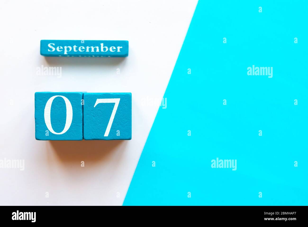 September 7, empty blue and white geometric background. Wooden handmade ...