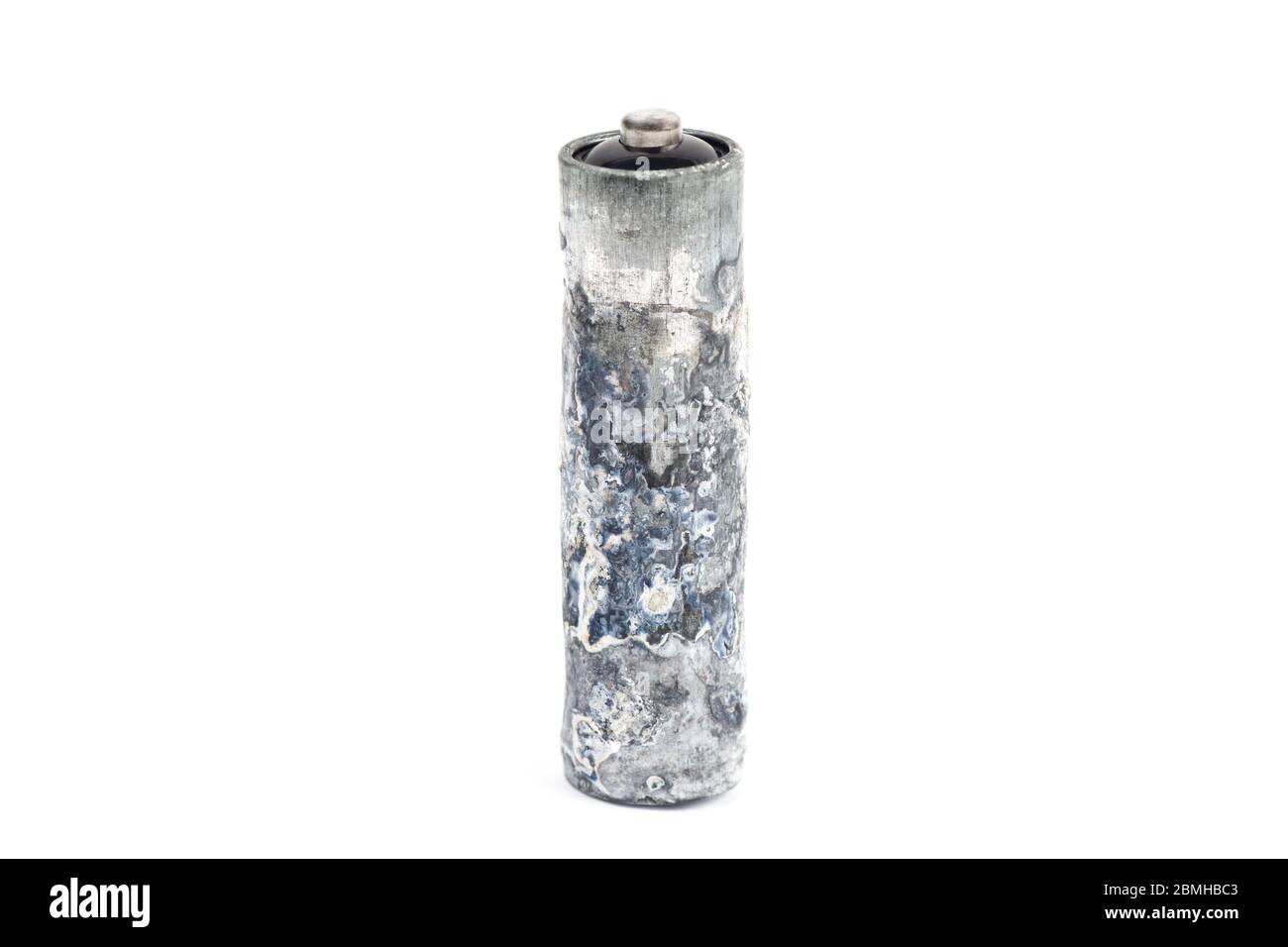 Close-up of a heavily oxidized unwrapped AA battery isolated on white ...