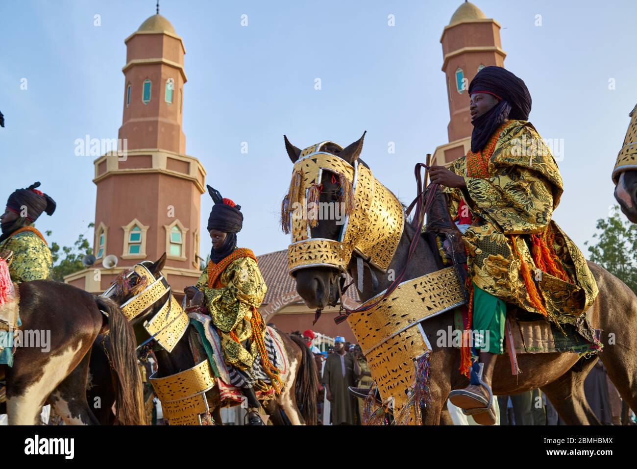Noblemen riders dressed in a colourful outfit mounting embellished ...