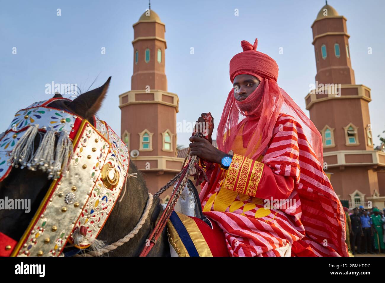 Nobleman rider dressed in a colourful outfit mounting an embellished ...