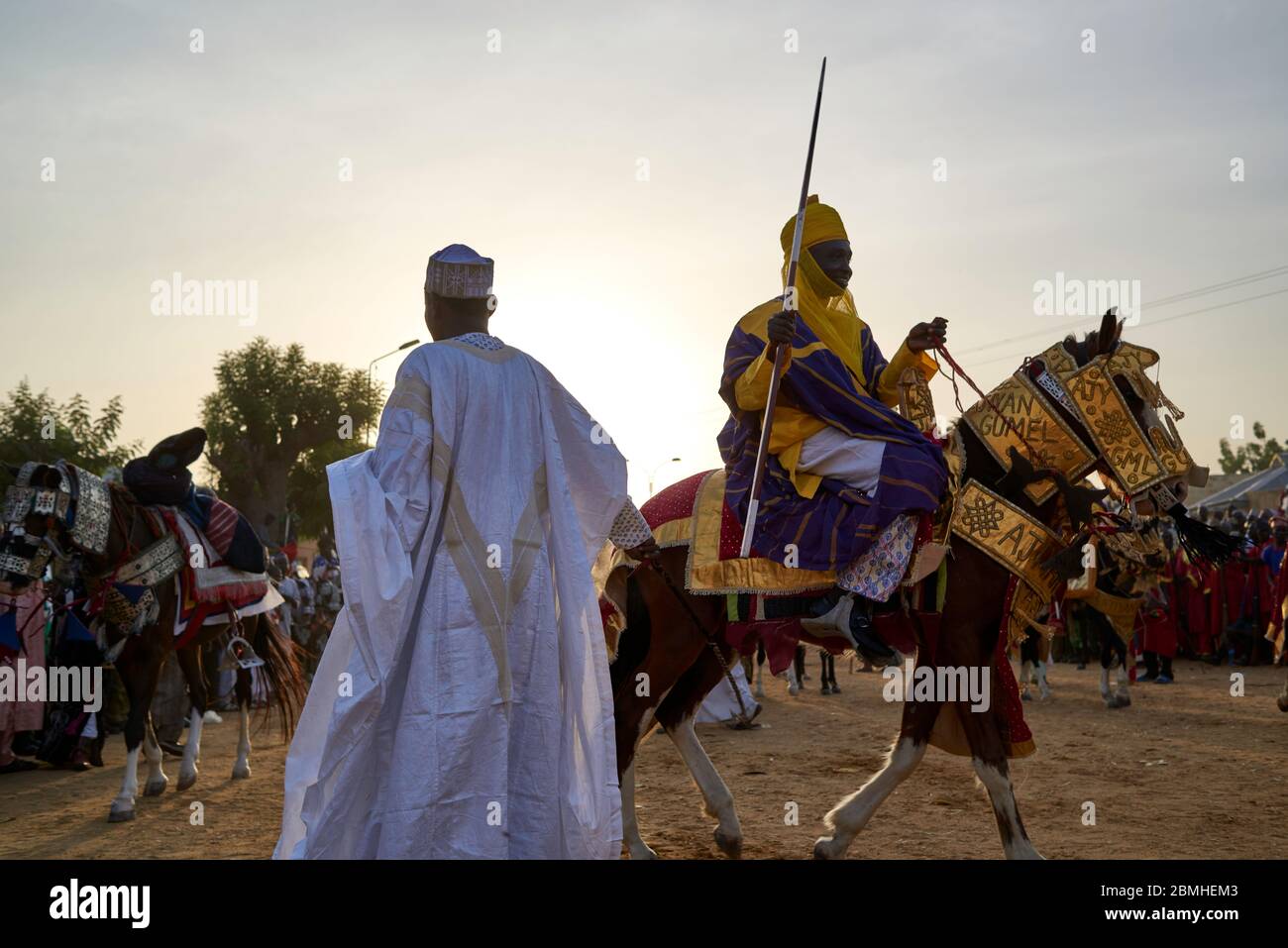 Nobleman rider dressed in a colourful outfit mounting an embellished ...