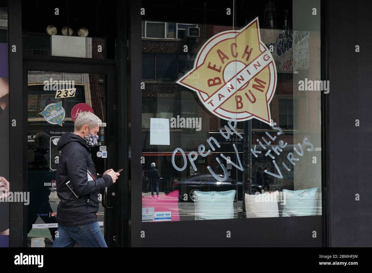New York, NY, USA. 9th May, 2020. Graffiti on the window of a Beach Bum ...