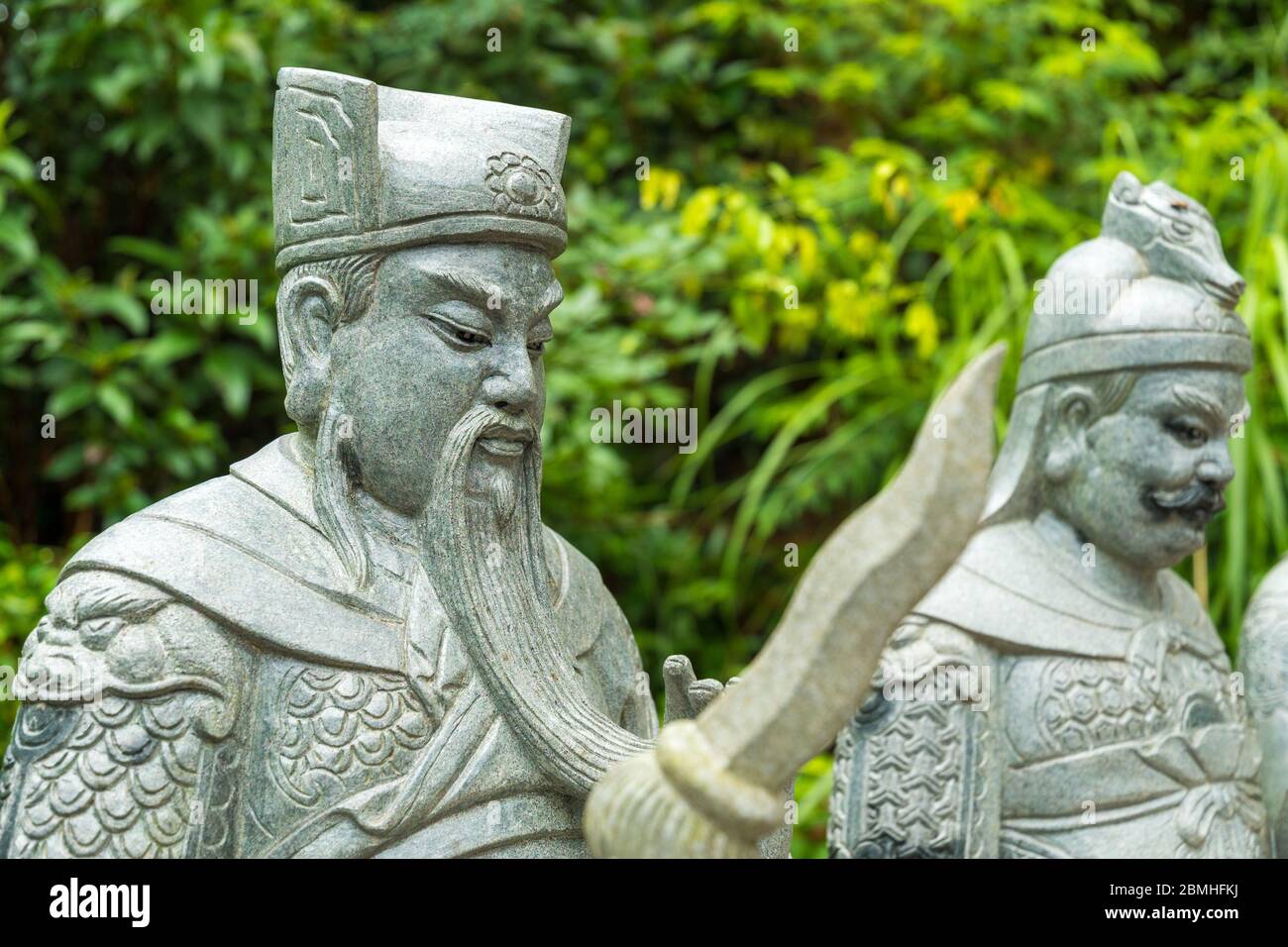 Standing stone statue with weapon at the buddhist Temple of Ten ...