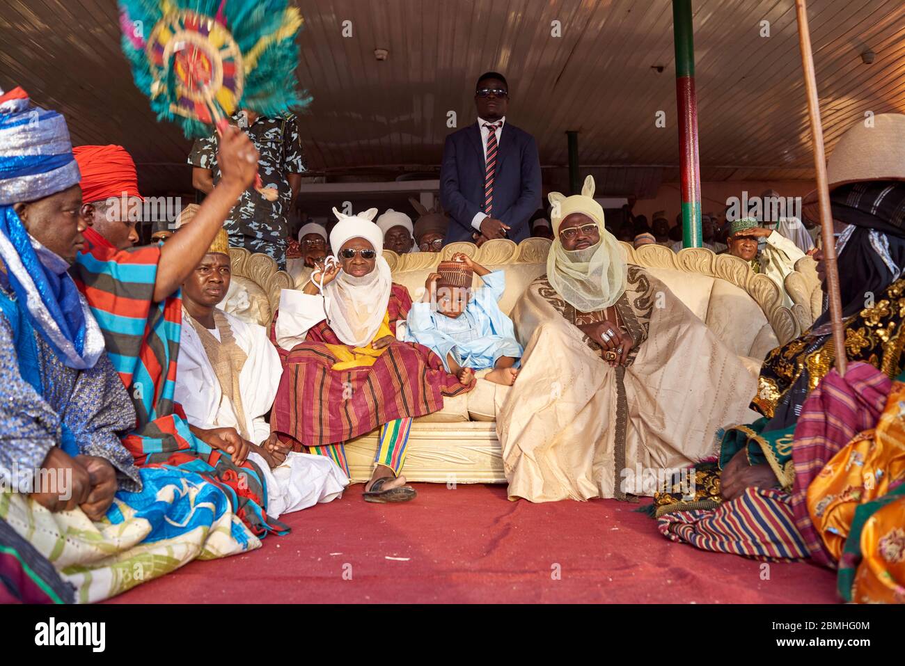 Emir of the city of Gumel with bodyguards and his entourage dressed in ...
