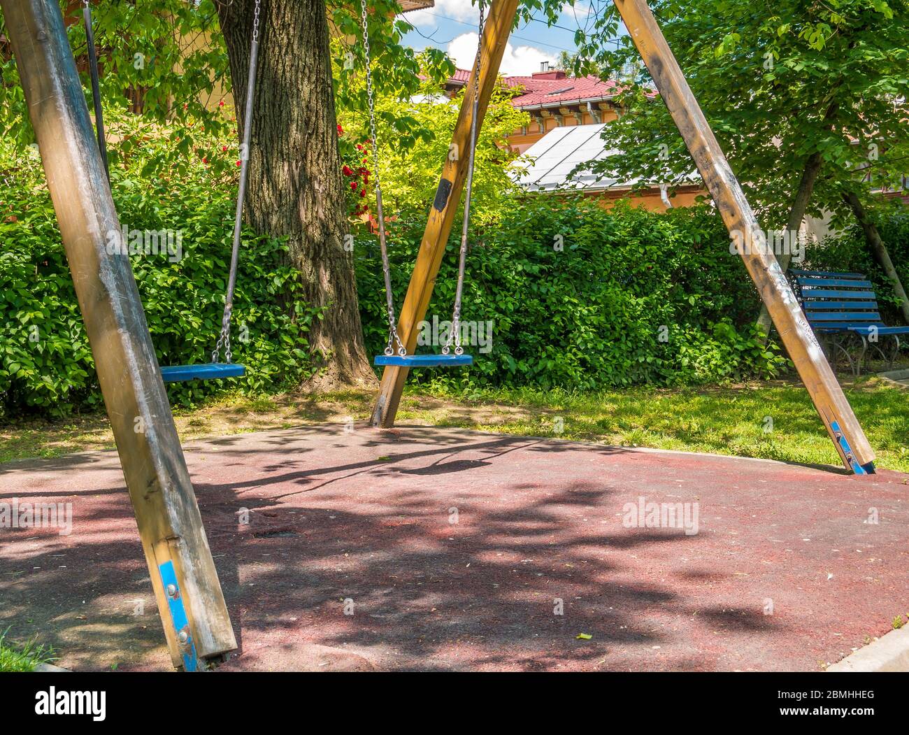 A children's playground in Bucharest, Romania. Children swings in a ...