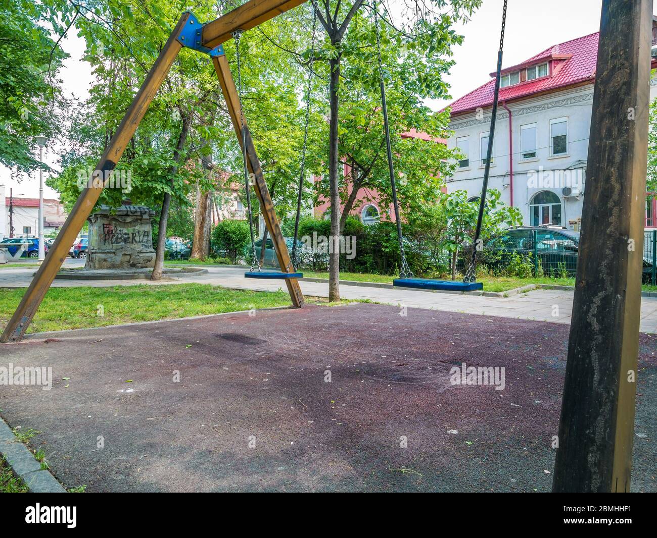 A children's playground in Bucharest, Romania. Children swings in a ...