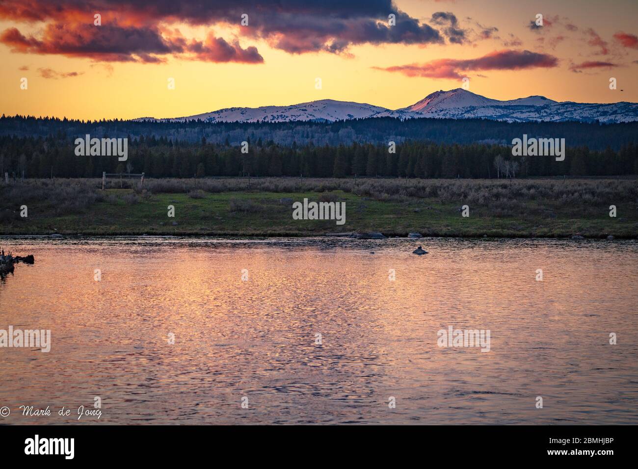 Sunset reflection over a quiet pond Stock Photo - Alamy