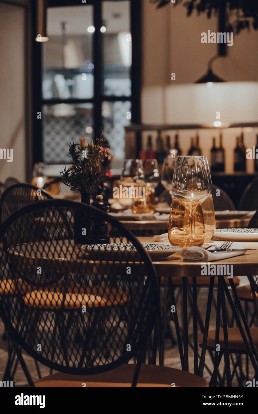Tables set inside a restaurant, shallow focus Stock Photo - Alamy