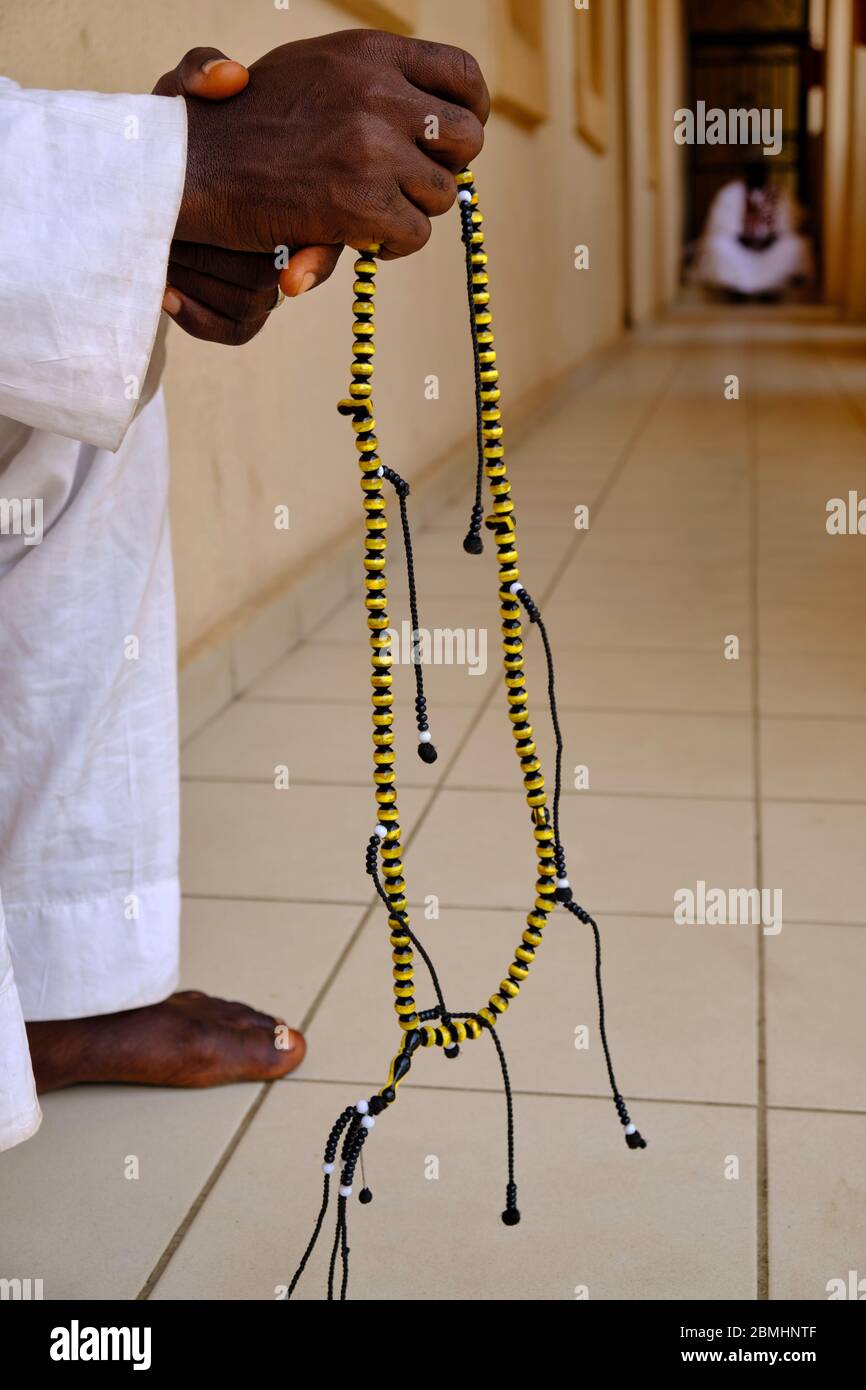 Man with a muslim rosary in his hand Stock Photo - Alamy