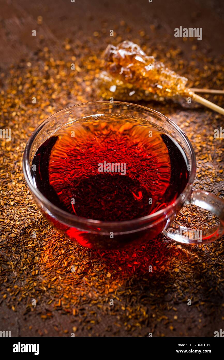 Cup of delicious rooibos tea on dark background Stock Photo - Alamy