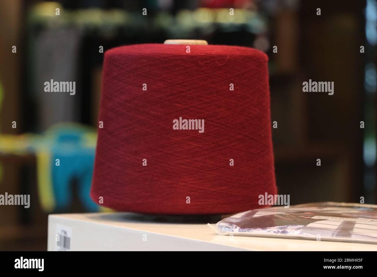 Dark red color yarn is waiting for starting for the production process ...