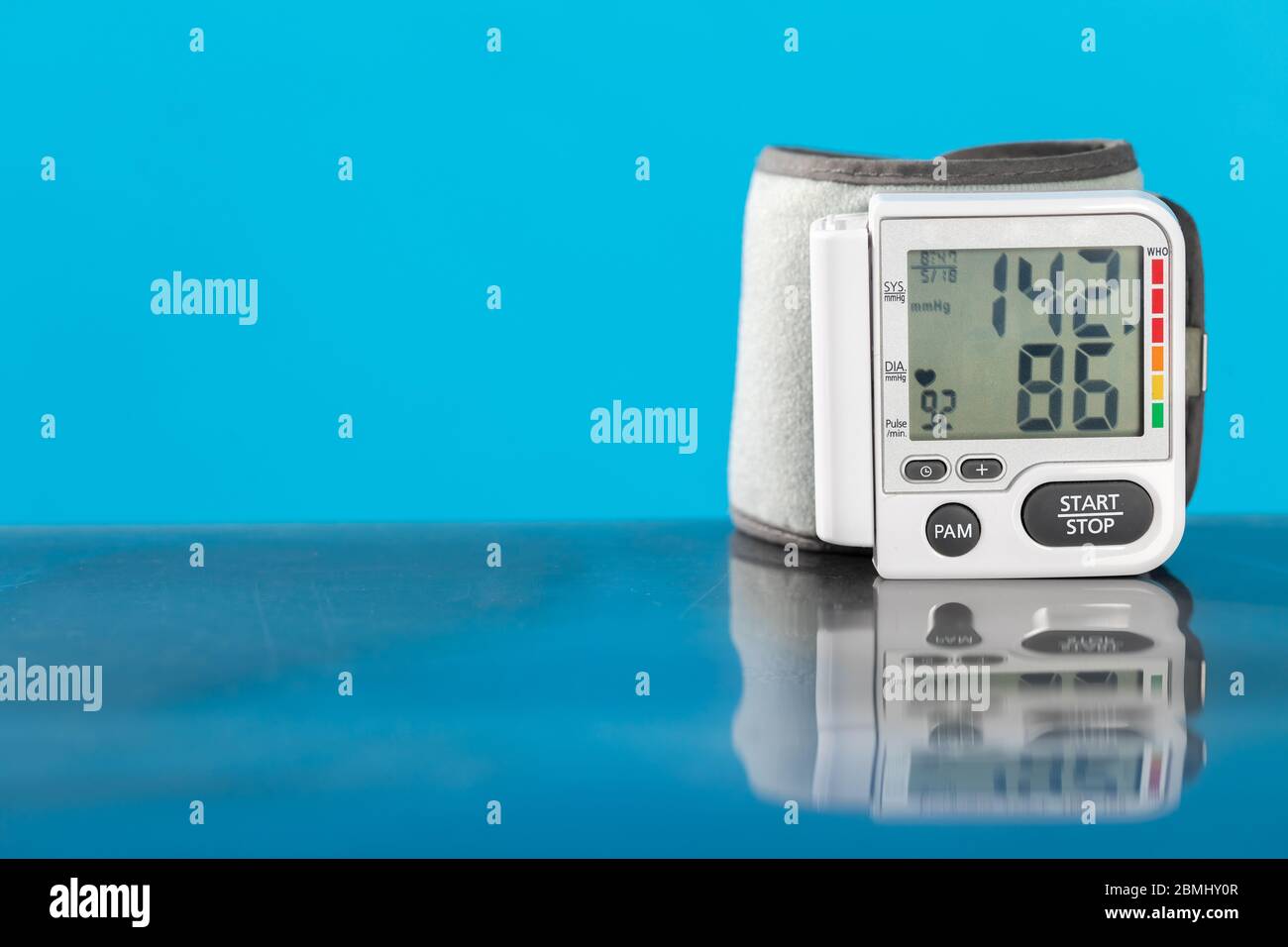 Isolated blood pressure apparatus on a blue background Stock Photo - Alamy