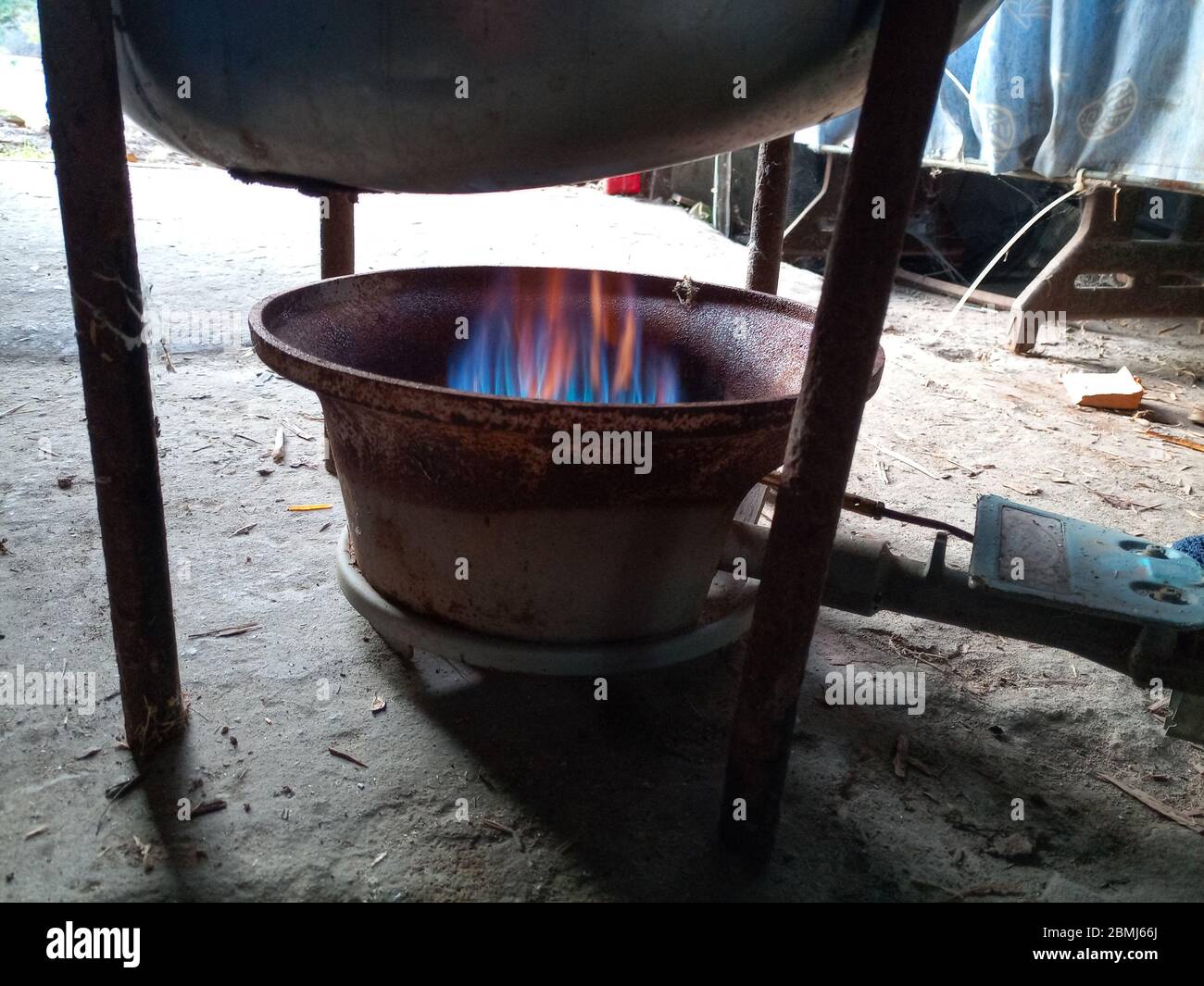 Work gas burner. Gas burner under the smokehouse tank Stock Photo - Alamy