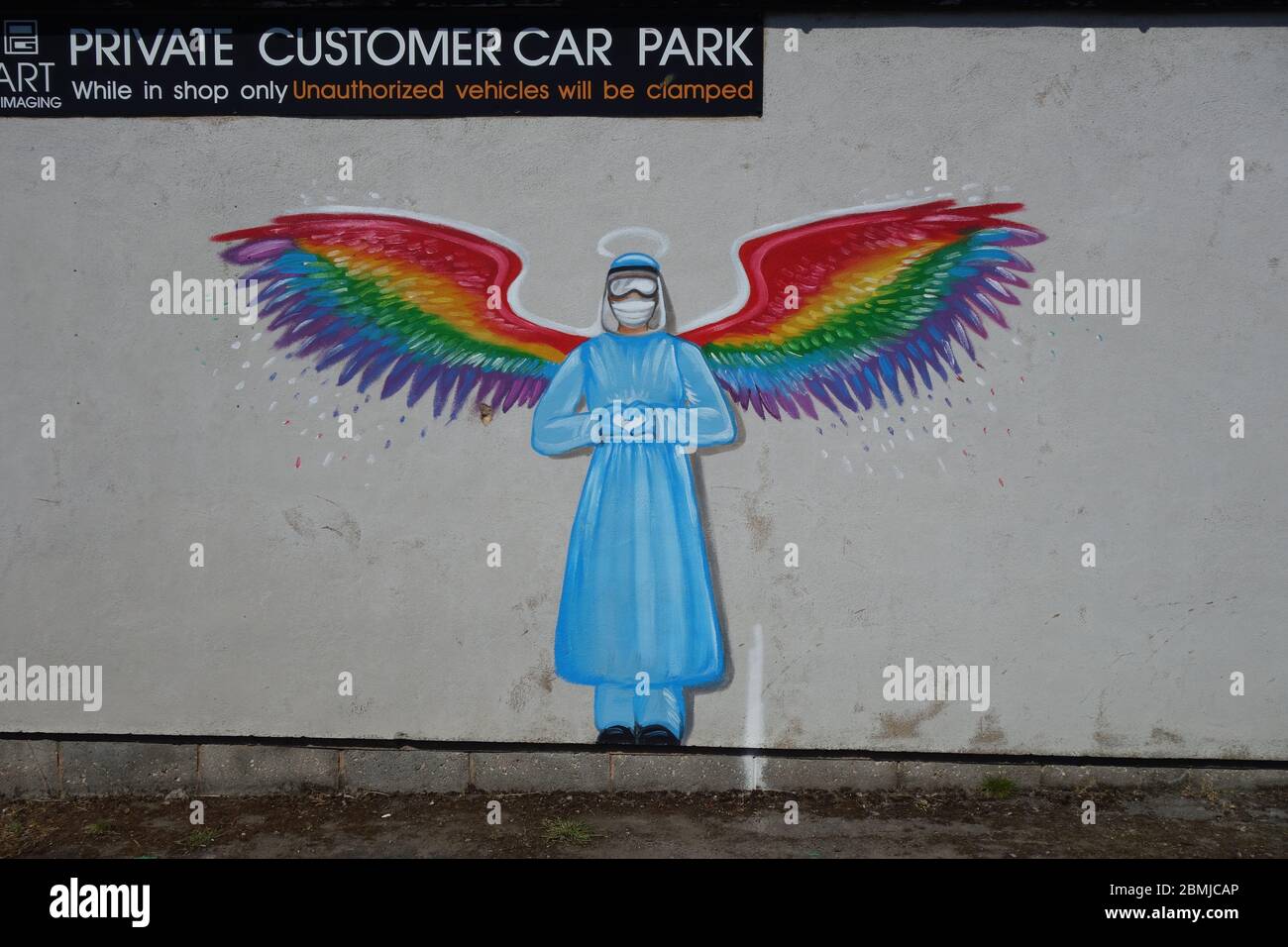 A nurse in PPE with angel wings, an NHS tribute wall mural by ...