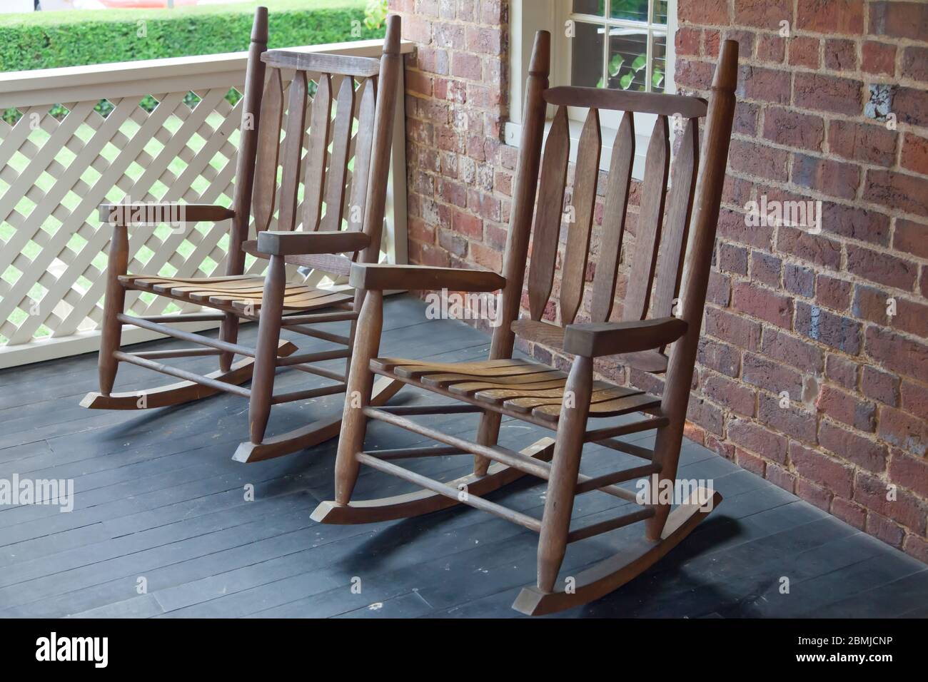 Rocking chairs on a porch Stock Photo - Alamy
