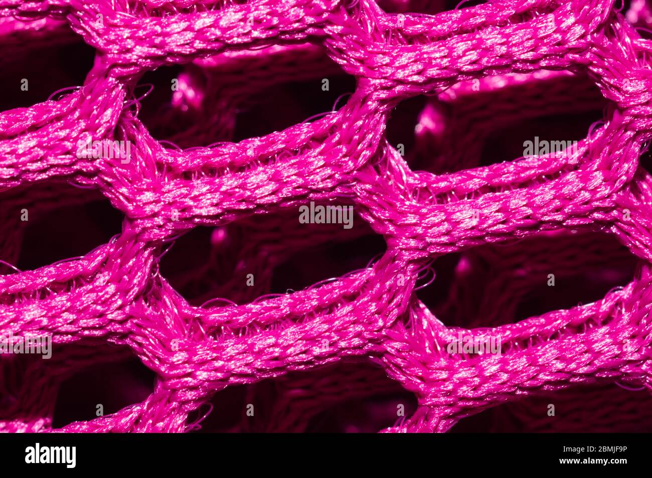 Pink fabric texture macro. abstract knitted pattern. woven material ...
