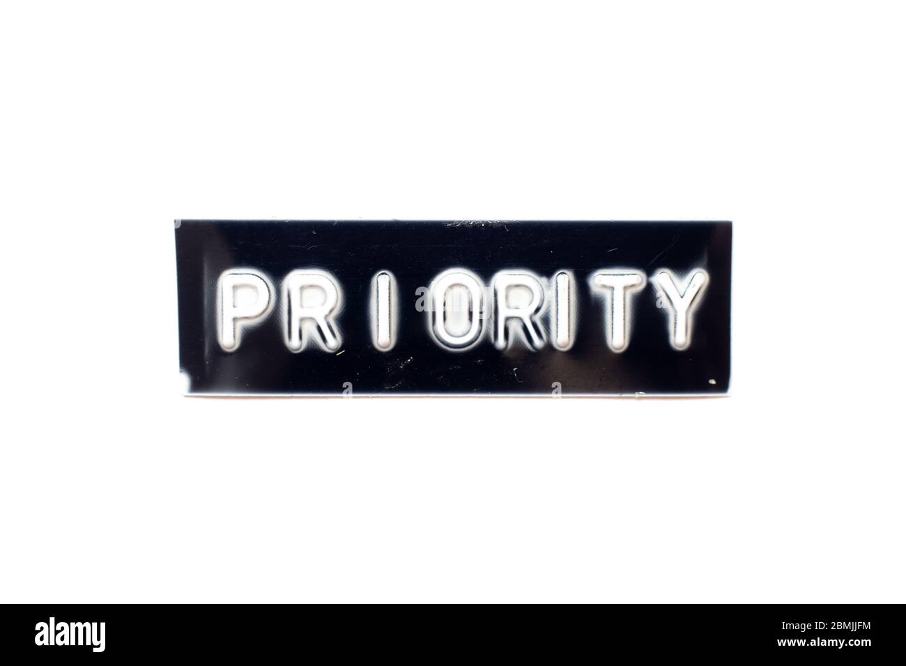 Embossed letter in word priority in black banner on white background ...