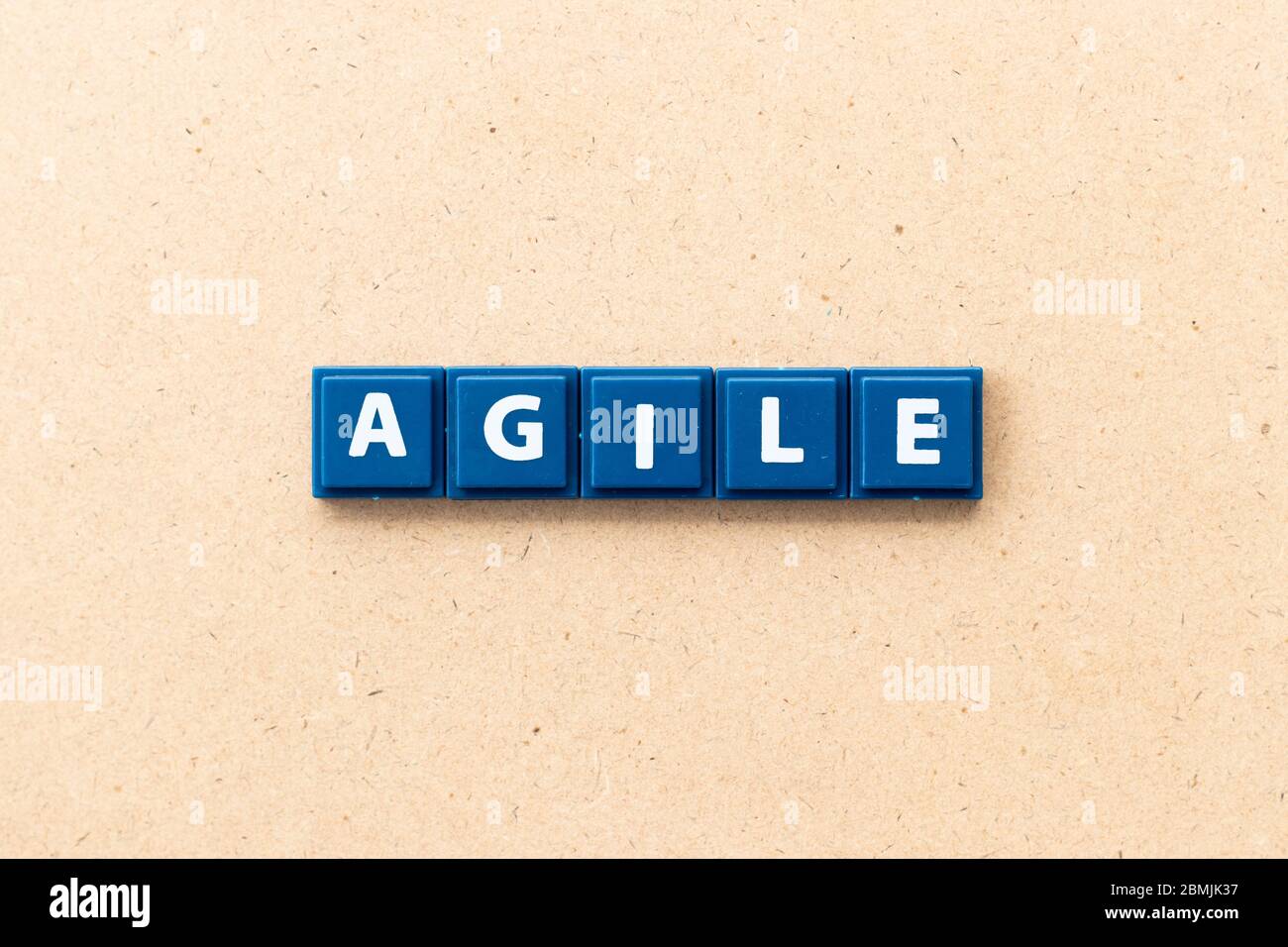 Tile letter in word agile on wood background Stock Photo - Alamy
