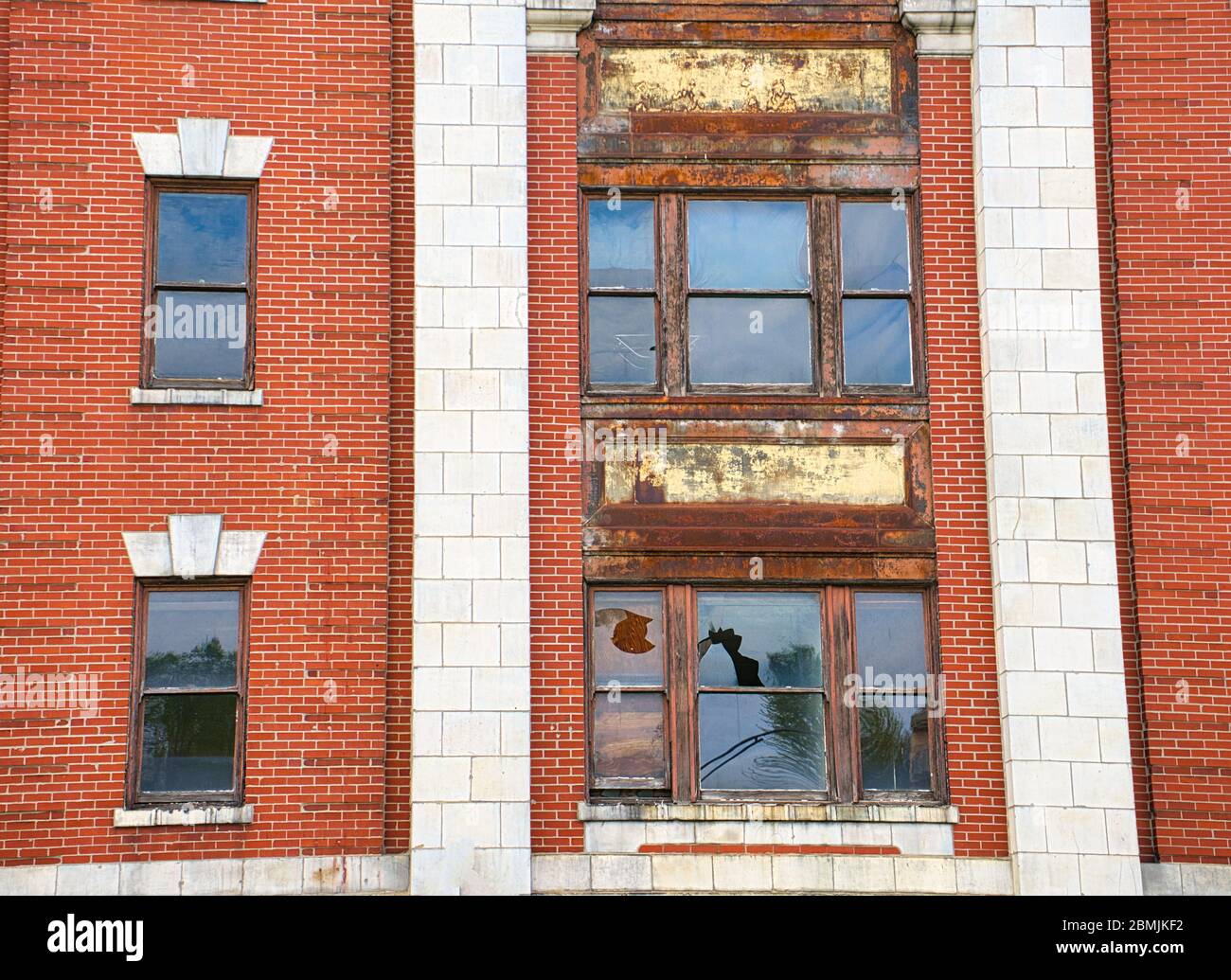 Abandoned building with some broken windows Stock Photo - Alamy