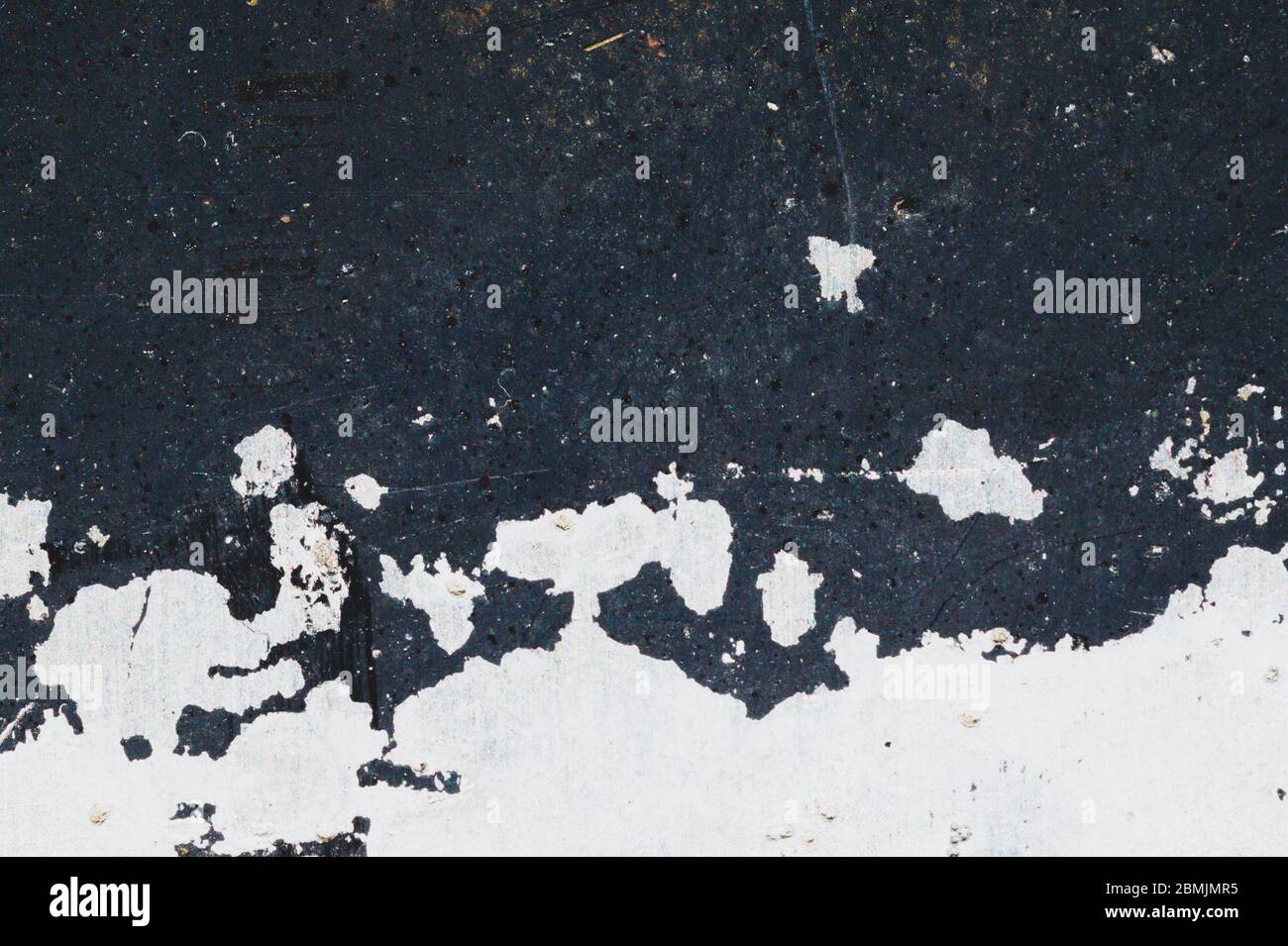 Black steel plate with white paint spots. metal surface with paint ...