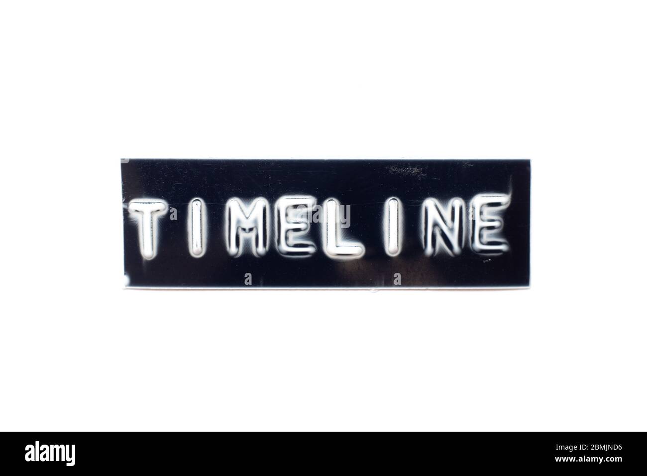 Embossed letter in word timeline in black banner on white background ...