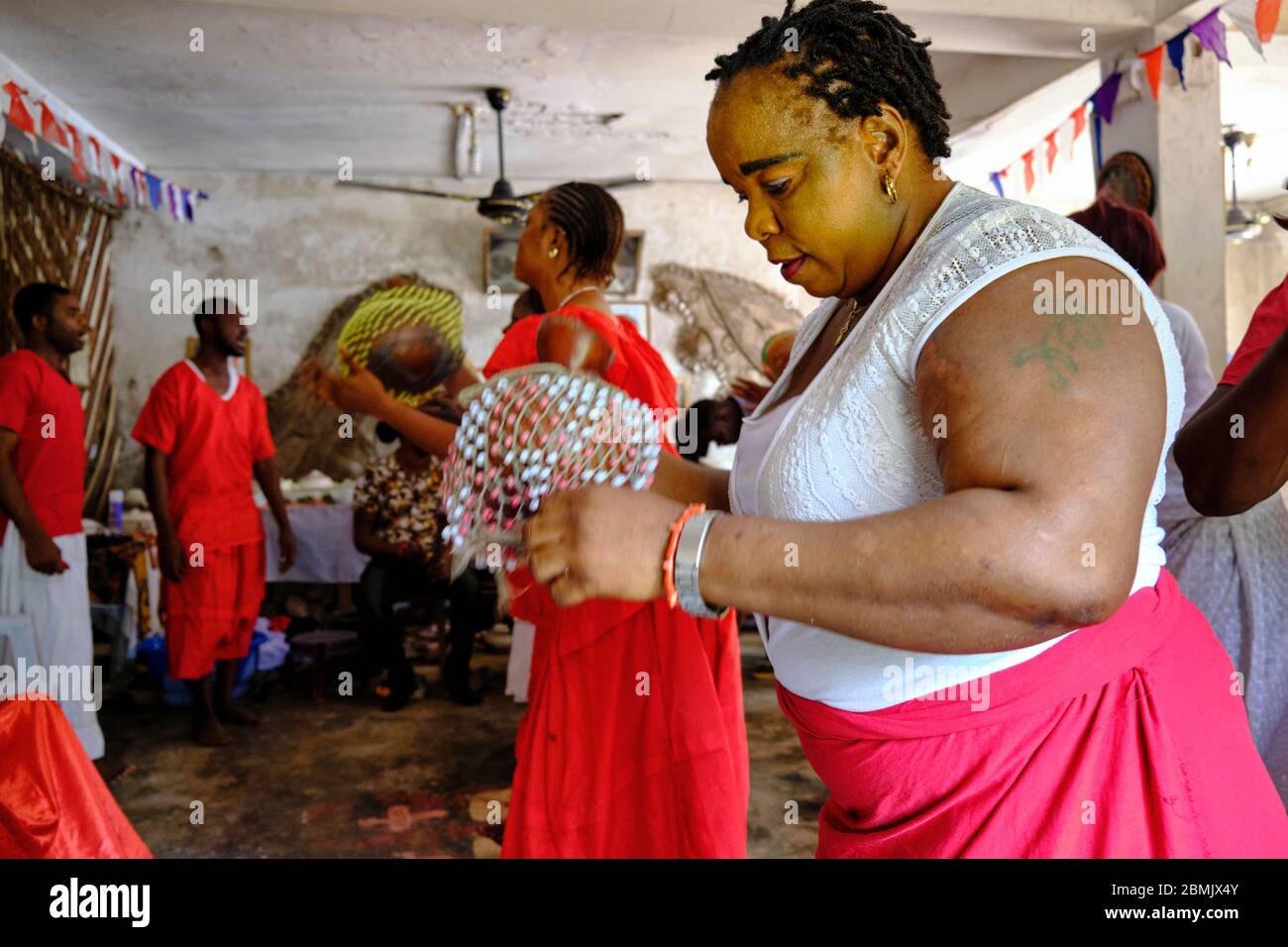 Women dancing during a ceremony in a temple dedicated to the Orisha ...