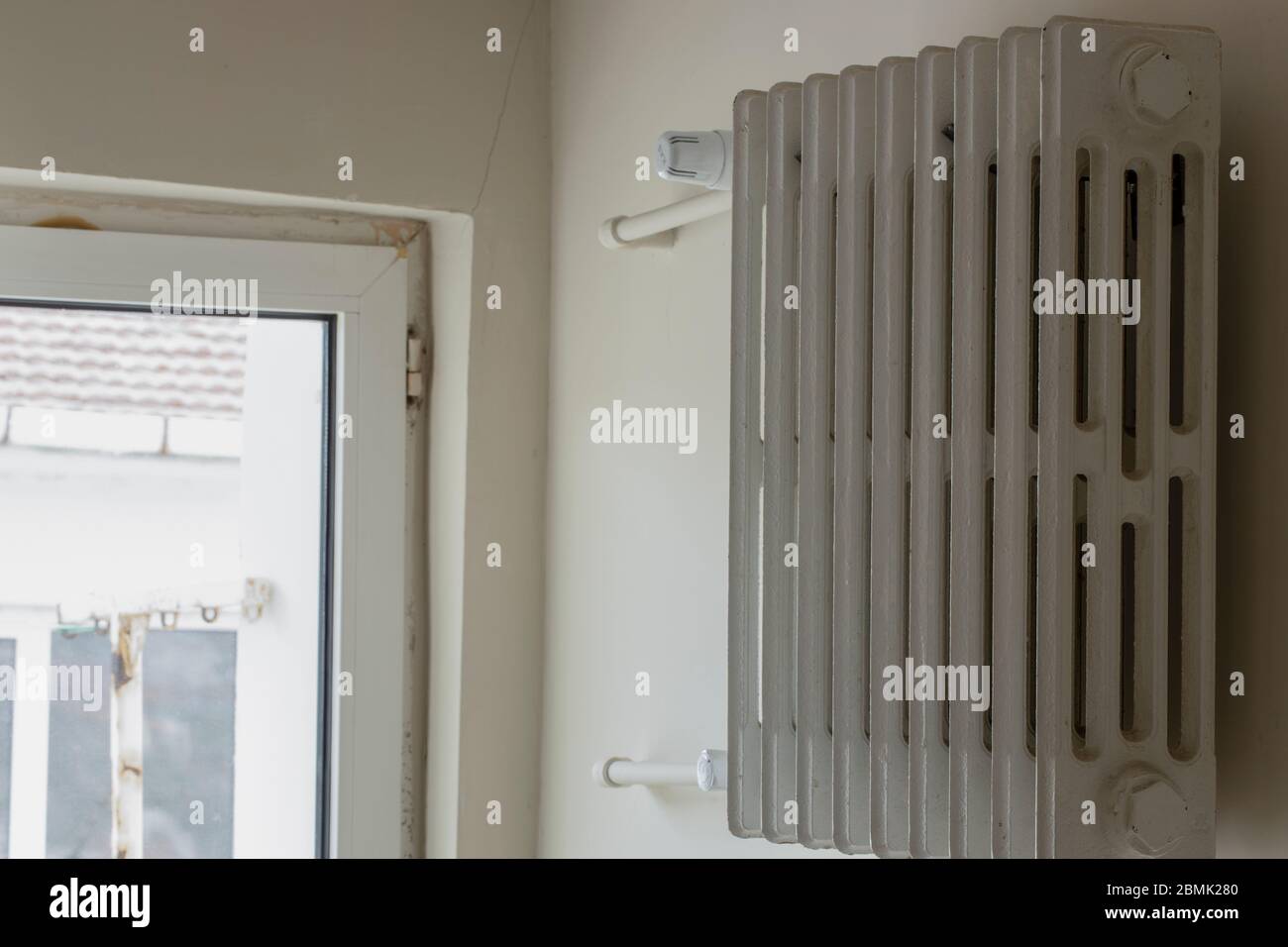 Cast iron radiator close-up. Part of the radiator was pulled Stock ...