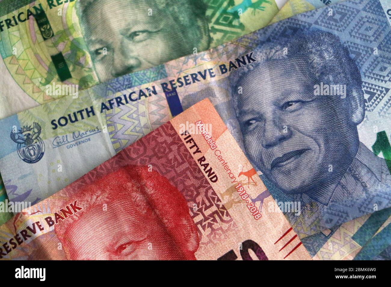 South African currency money rands notes scattered on white background ...