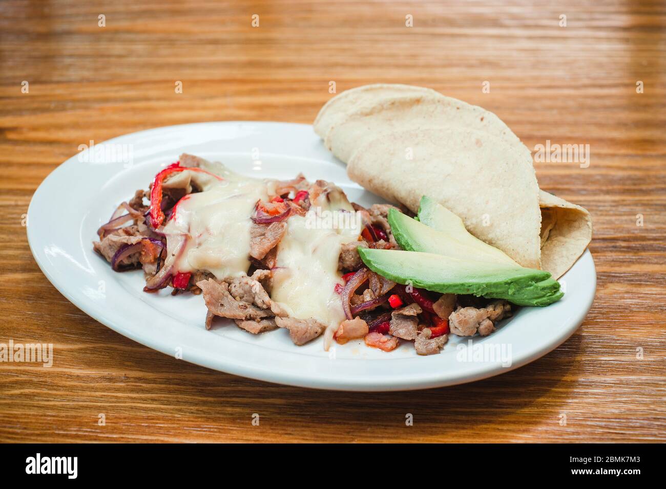 Mexican food, Alambre is made with Beef, onion, bacon, chili, cheese ...
