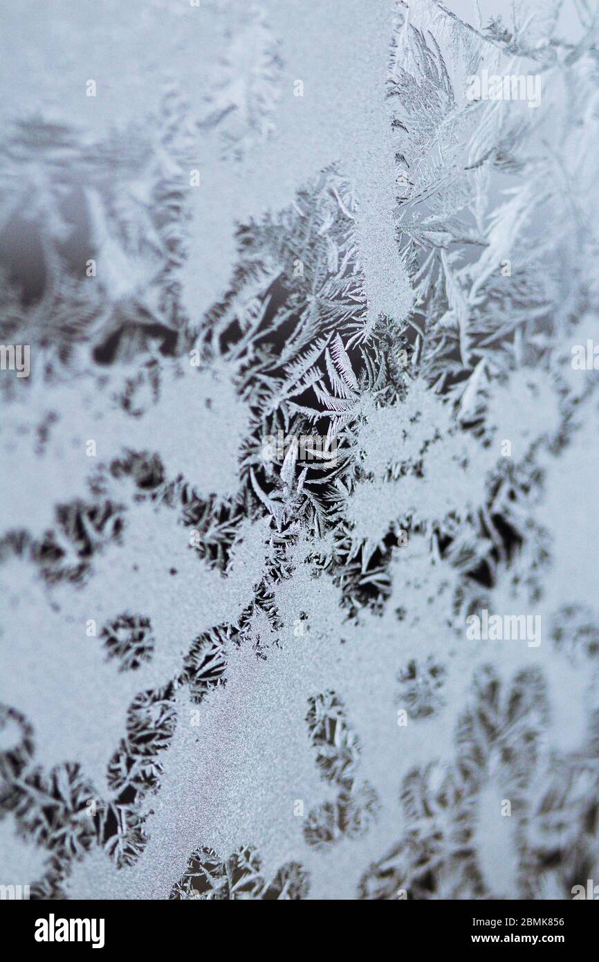 Ice formation on a window during the winter season Stock Photo - Alamy