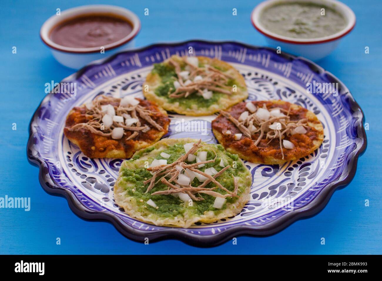 chalupas poblanas, mexican food Puebla Mexico on a blue background ...