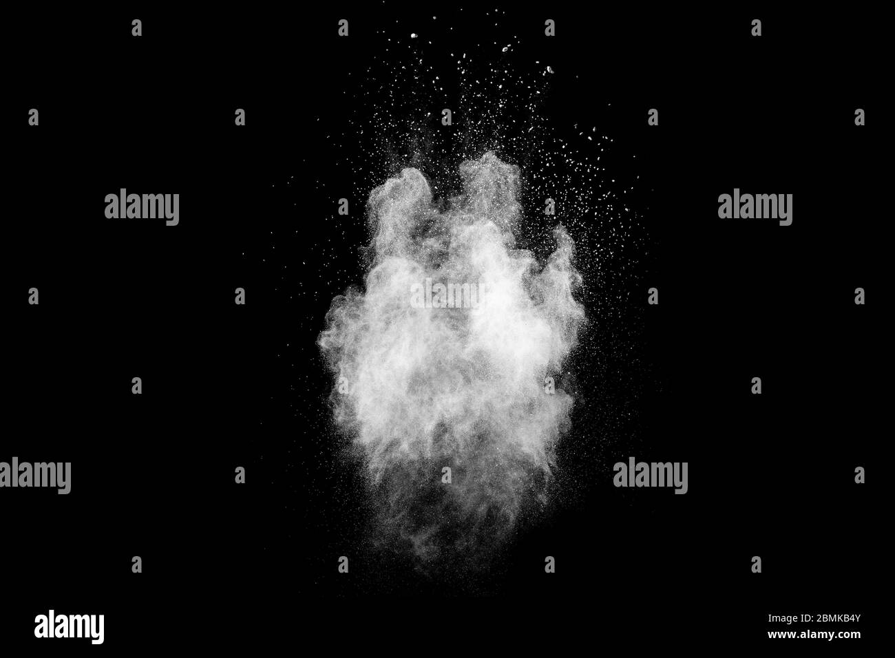 White talcume powder explosion on black background. White dust ...