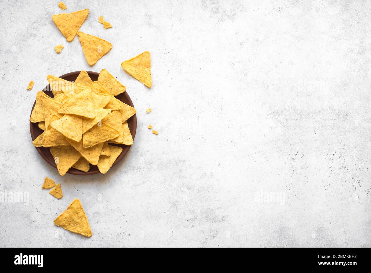 Mexican Corn Chips Nachos on white background, top view, copy space ...