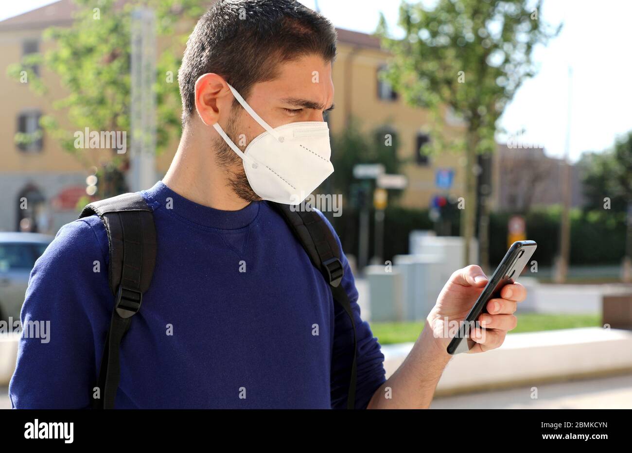 COVID-19 Mobile Application Young Man Wearing KN95 FFP2 Mask Using ...