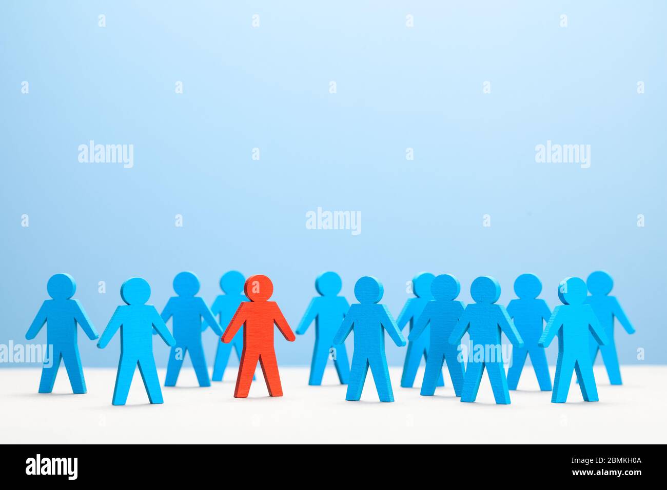 Team Leader. HR. The right choice of staff. Blue men and red leader ...